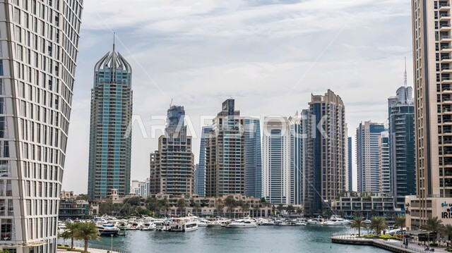Waterfront on the Arabian Gulf coast, movement of yachts and ships at ...