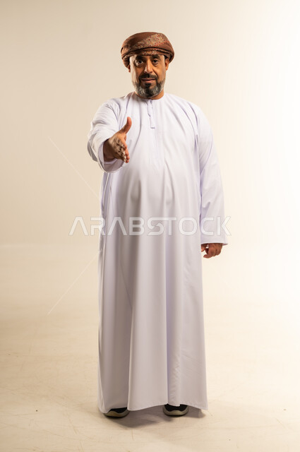 The concept of welcome and hospitality, portrait of an Arab Gulf Omani ...