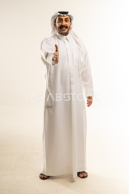 Greeting and peace, reception and welcome concept, portrait of a Qatari ...