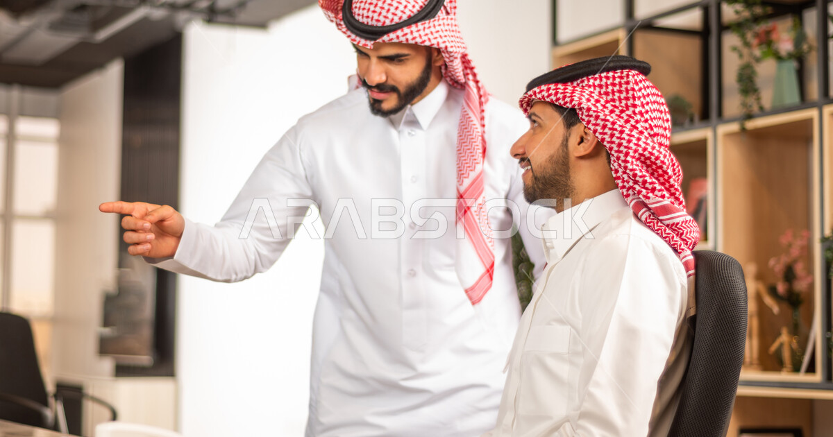Meeting of Saudi-Arab Gulf co-workers at their workplace, discussing ...