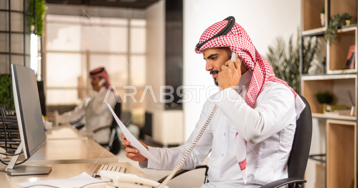 Two Saudi Arabian Gulf employees working at the company’s headquarters ...