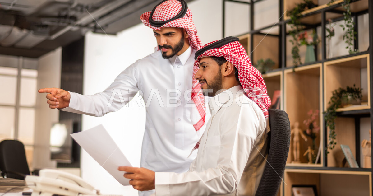 Meeting of Saudi-Arab Gulf co-workers at their workplace, discussing ...