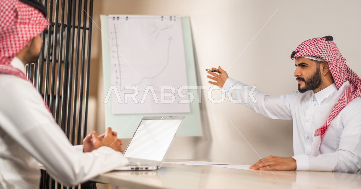 Meeting of Saudi-Arab Gulf co-workers at their workplace, discussing ...