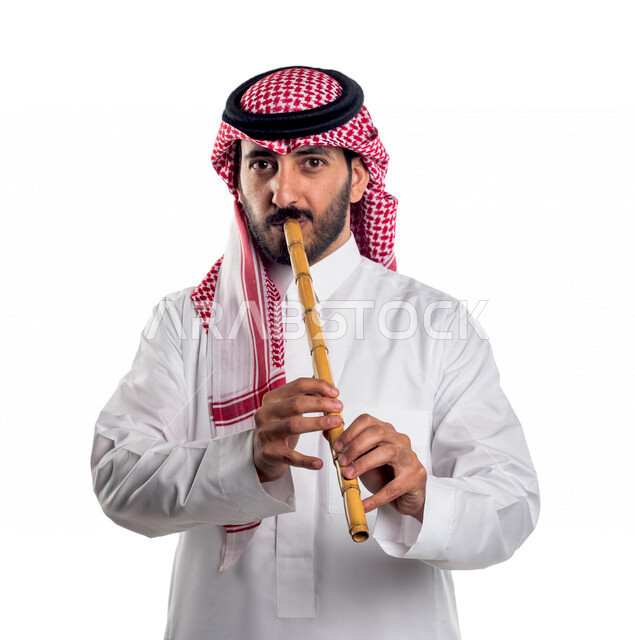 A picture of a Saudi Arabian Gulf man playing the flute, musical ...