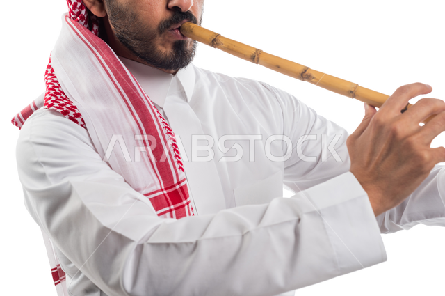 A picture of a Saudi Arabian Gulf man playing the flute, musical ...