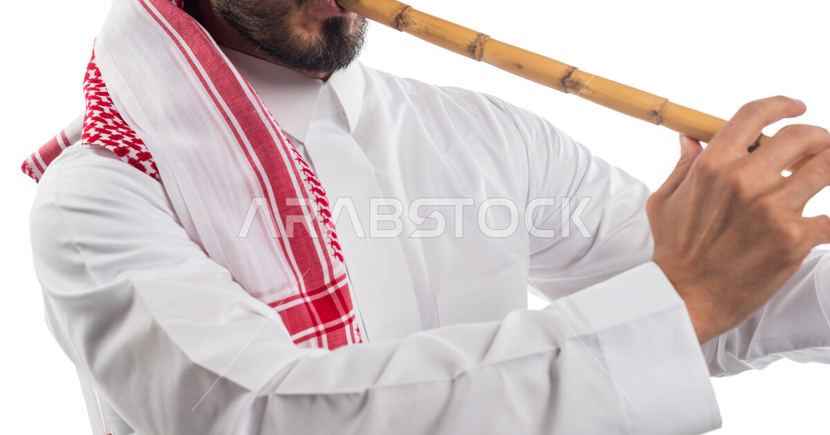 A picture of a Saudi Arabian Gulf man playing the flute, musical ...