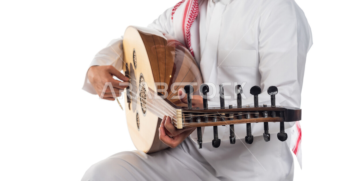 A close-up of a Saudi Arabian Gulf man playing the oud, musical ...
