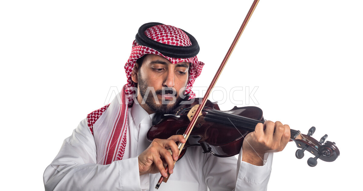 A close-up of a Saudi Arabian Gulf man playing the violin, musical ...