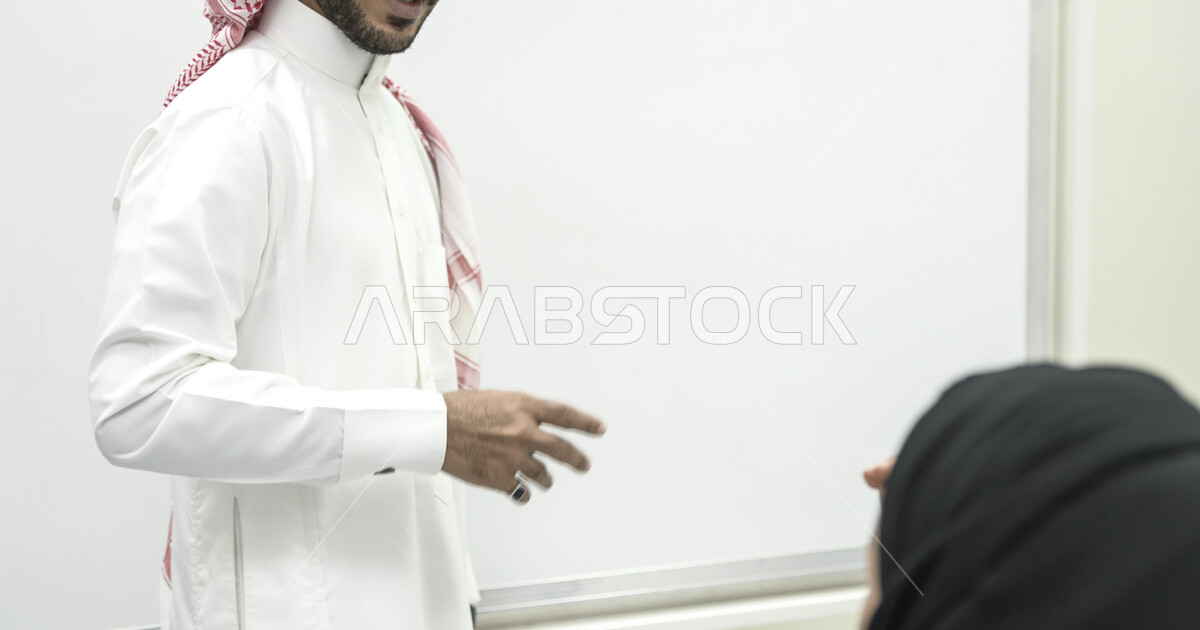 A Saudi Arabian Gulf university professor explains to his students the ...