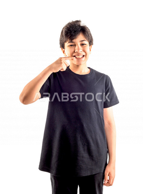 Portrait of a Saudi Arabian Gulf child doing a photo session, different ...