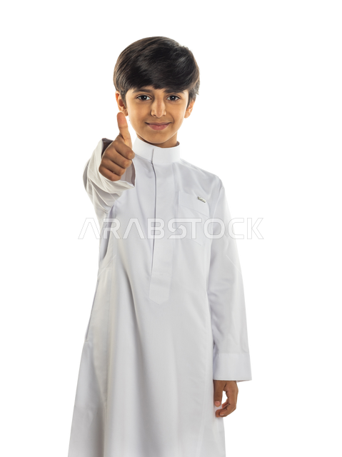 Portrait of a happy Saudi Arabian Gulf Arab child wearing traditional ...
