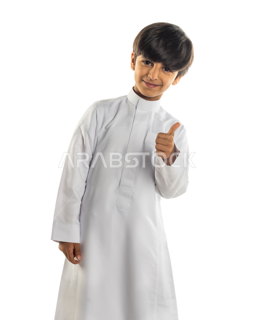 Portrait of a happy Saudi Arabian Gulf Arab child wearing traditional ...