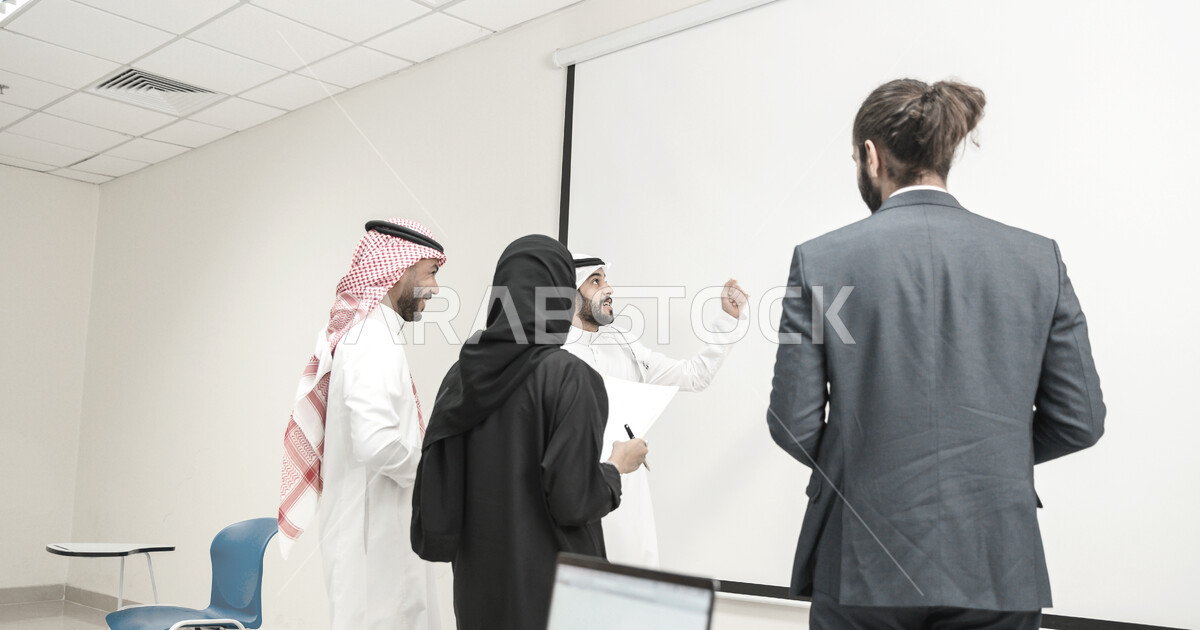 A Saudi Arabian Gulf university professor explains to his students the ...