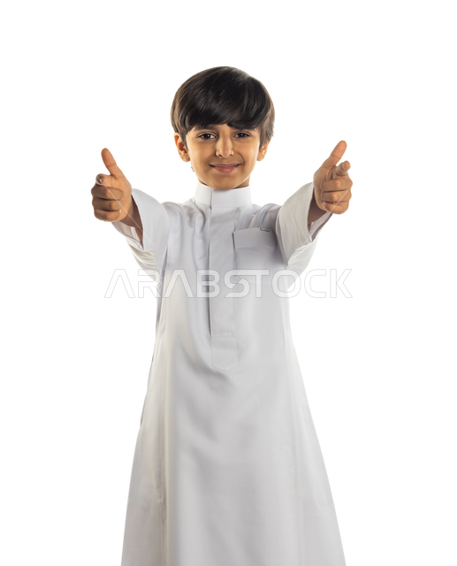 Portrait of a happy Saudi Arabian Gulf Arab child wearing traditional ...