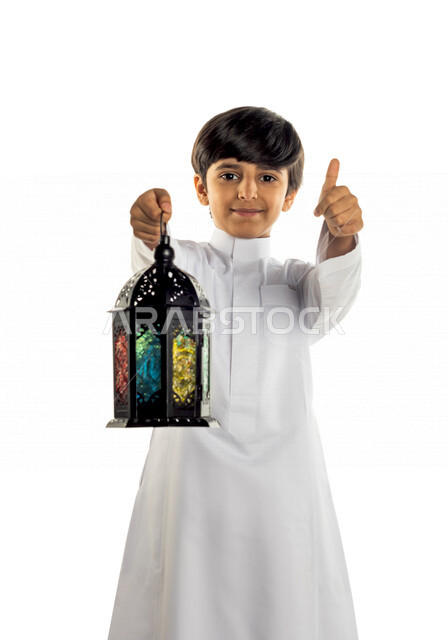 Portrait of a happy Saudi Arabian Gulf Arab child wearing traditional ...