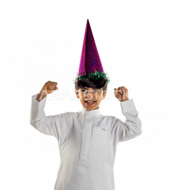 Portrait of a happy Saudi Arabian Gulf Arab child wearing traditional ...