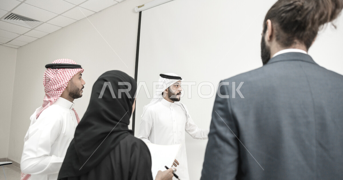 A Saudi Arabian Gulf university professor explains to his students the ...