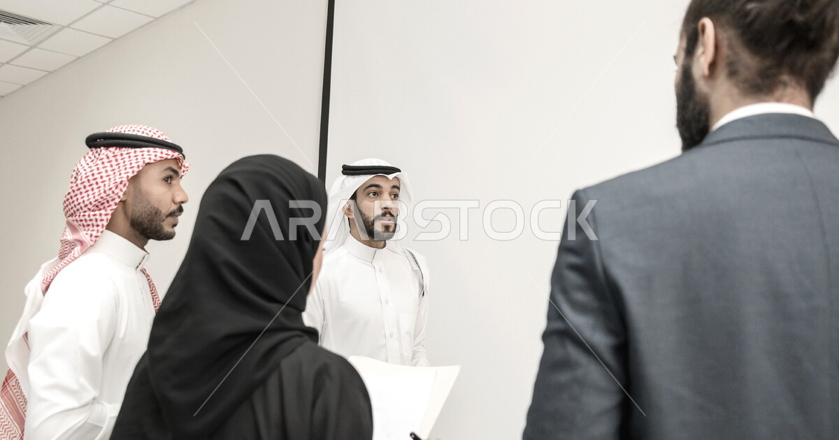 A Saudi Arabian Gulf university professor explains to his students the ...