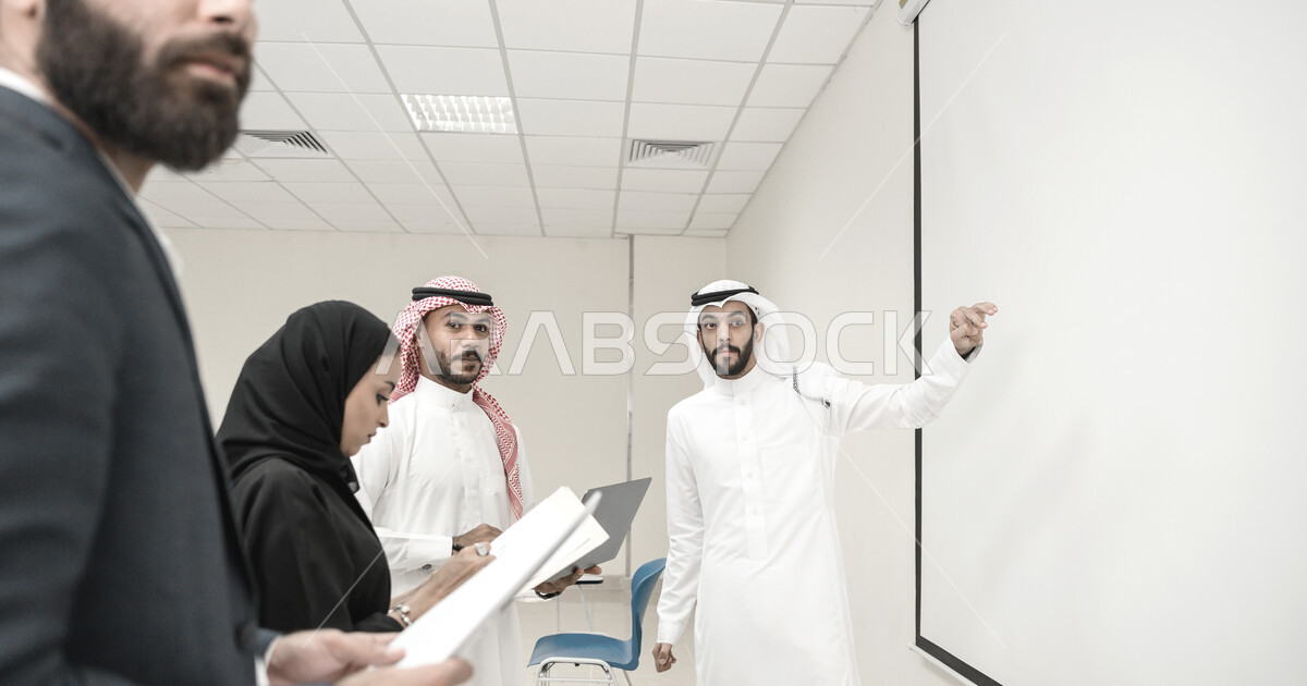 A Saudi Arabian Gulf university professor explains to his students the ...