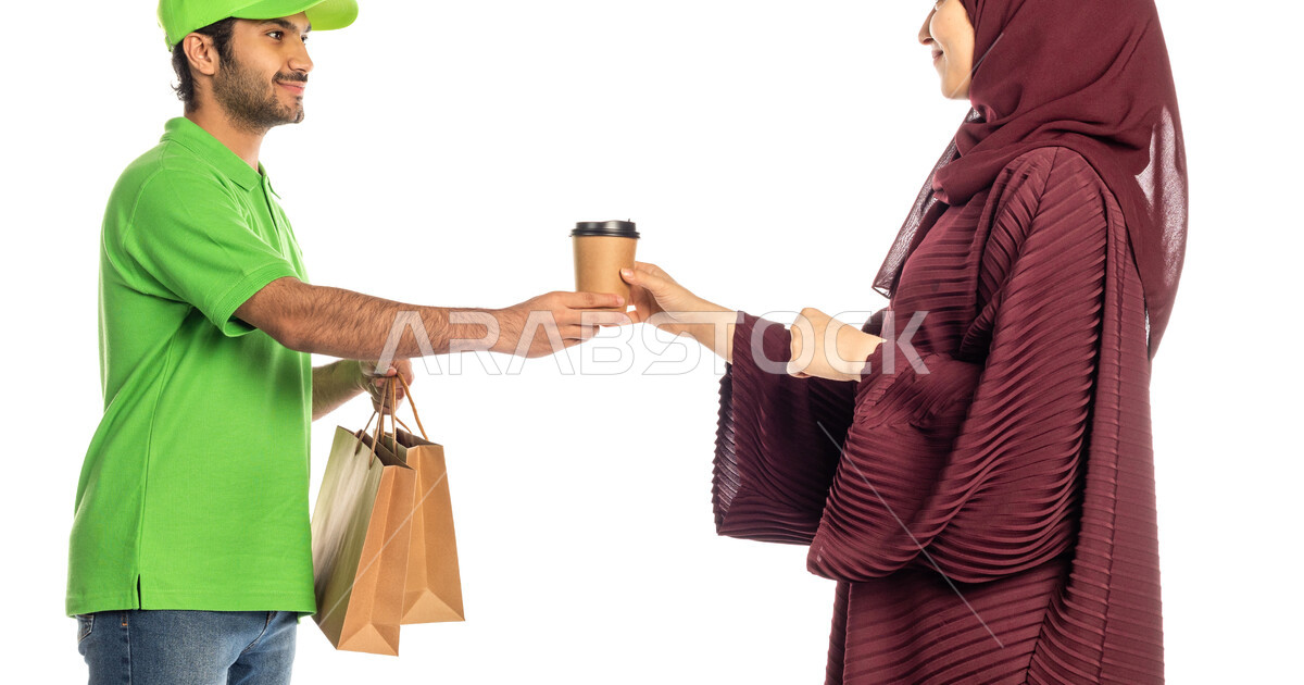 Portrait of a Saudi Arabian Gulf man wearing a green hat delivering ...