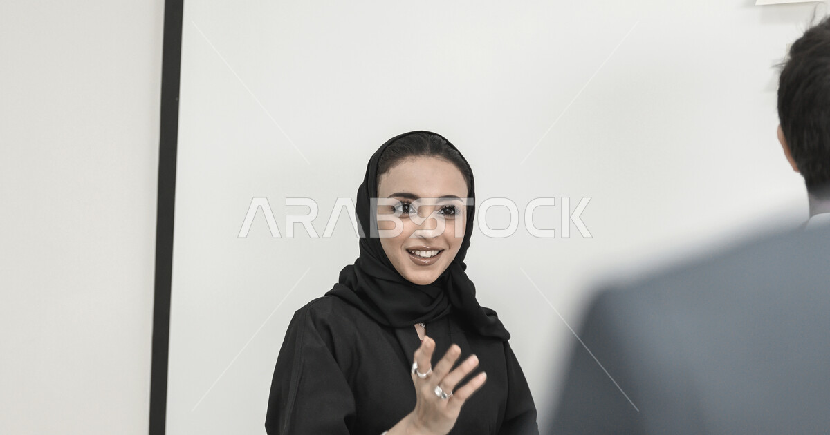 A Saudi Arabian Gulf university professor explains to her students the ...
