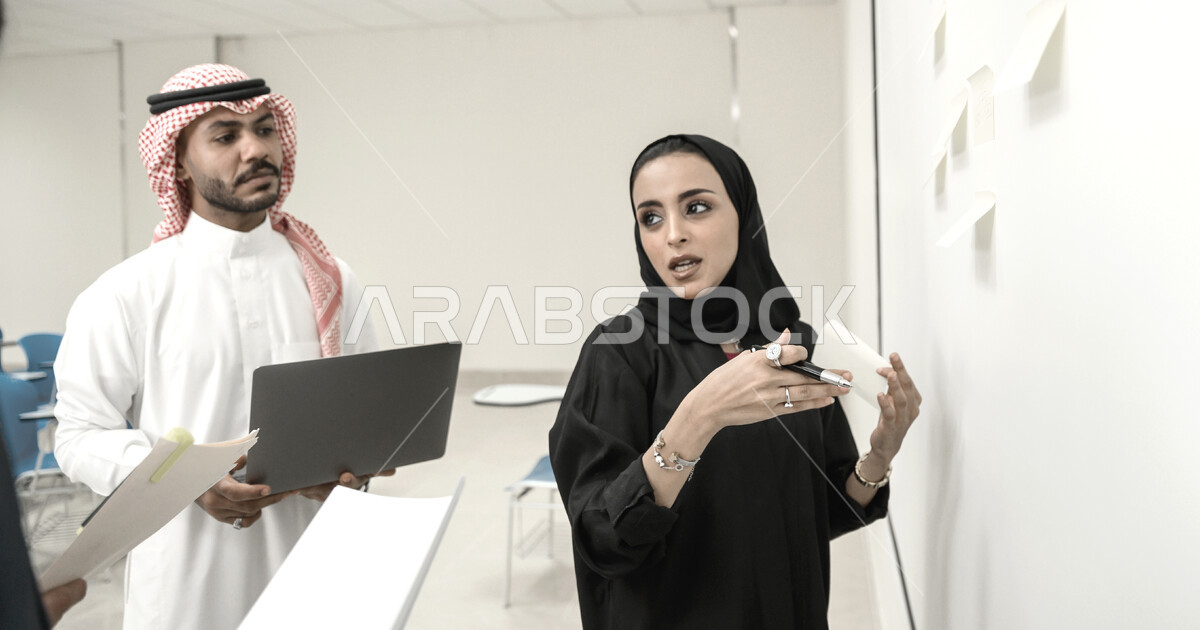 A Saudi Arabian Gulf university professor explains to her students the ...