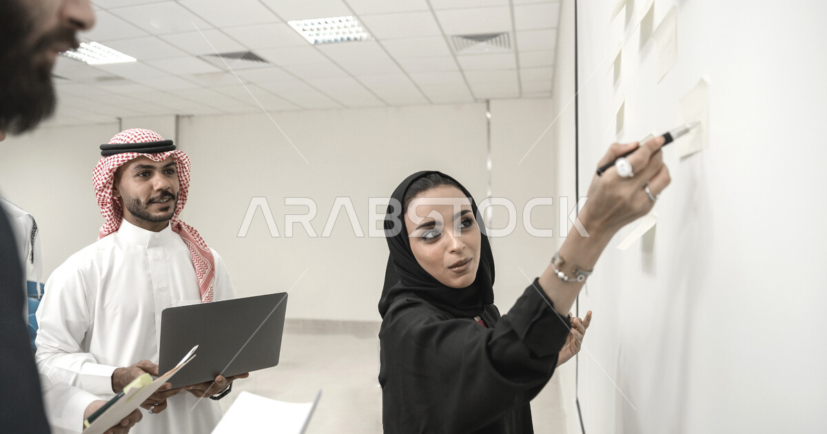 A Saudi Arabian Gulf university professor explains to her students the ...