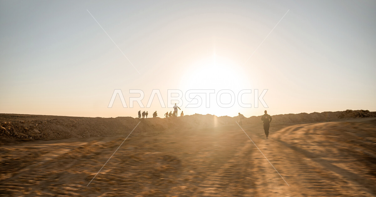 A picture of a group of Saudi Arabian Gulf youth, hiking, walking in ...