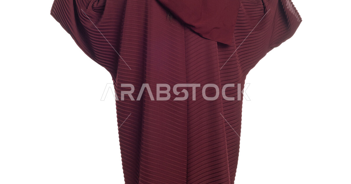 Portrait from behind of a Saudi Arabian Gulf woman wearing a burgundy ...