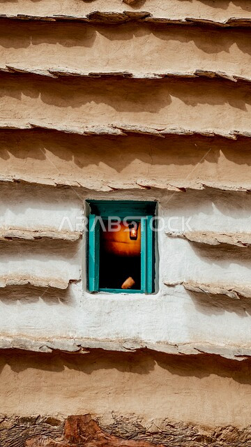 A picture of a window in the wall of an archaeological, touristic ...