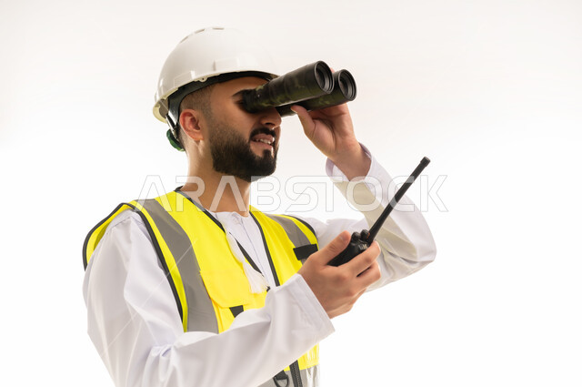Giving work orders, close-up portrait of an Arab Gulf Omani engineer ...