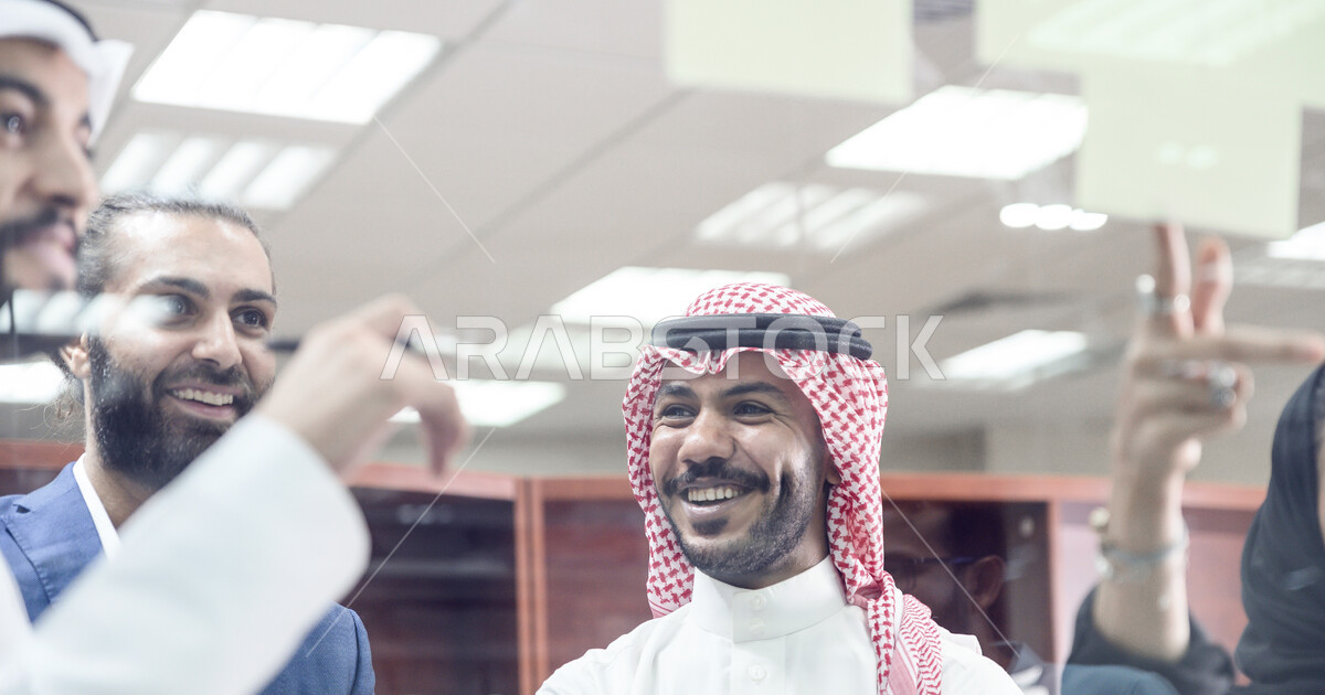 A Saudi Arabian Gulf work team inside the company, a work meeting ...