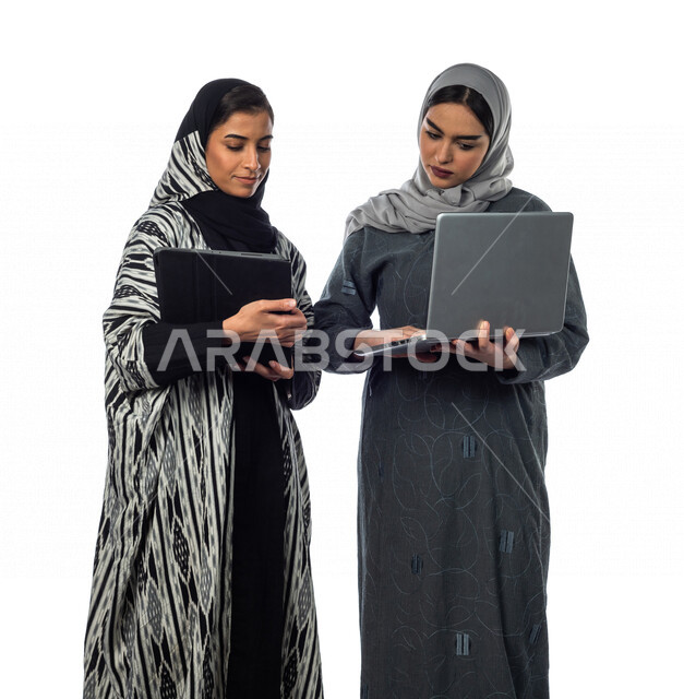 Portrait of a Saudi Arabian Gulf businesswoman with her laptop in hand ...