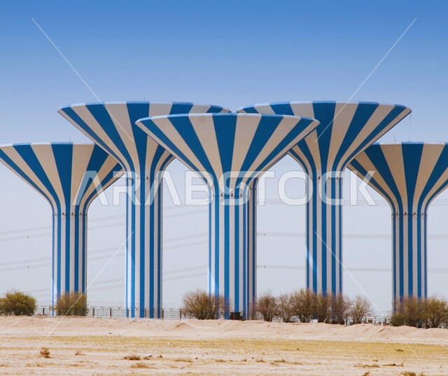Architectural art of blue and white striped water towers in Kuwait City ...