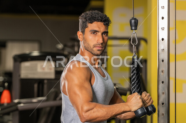 Gestures of strength and confidence, Saudi man doing muscle ...