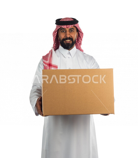 Portrait of a Saudi Arabian Gulf man wearing a Saudi dress working in ...