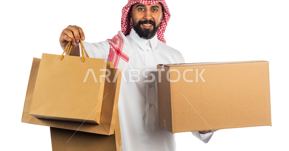 Portrait of a Saudi Arabian Gulf man wearing a Saudi dress working in ...