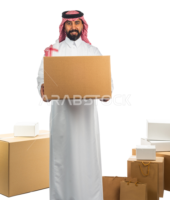 Portrait of a Saudi Arabian Gulf man wearing a Saudi dress working in ...