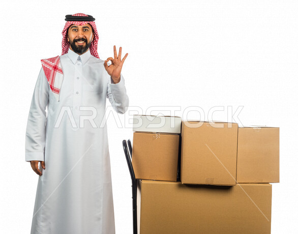 Portrait of a Saudi Arabian Gulf man wearing a Saudi dress working in ...