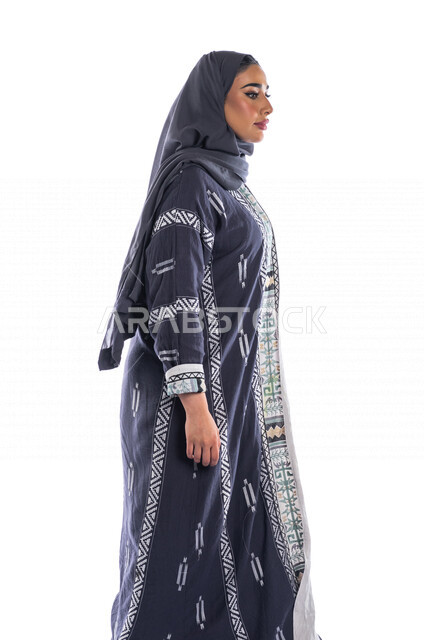 Portrait of a Saudi Arabian Gulf woman walking at speed, with different ...