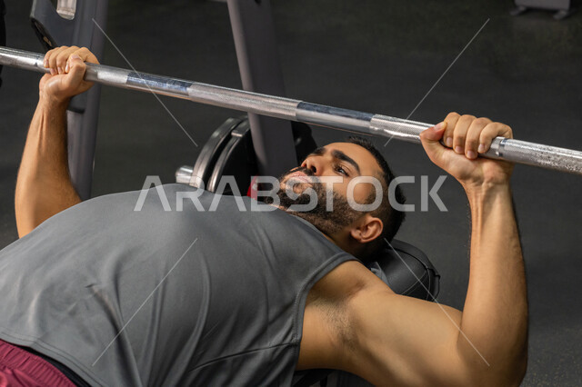 Saudi man doing muscle strengthening activities, health and fitness ...