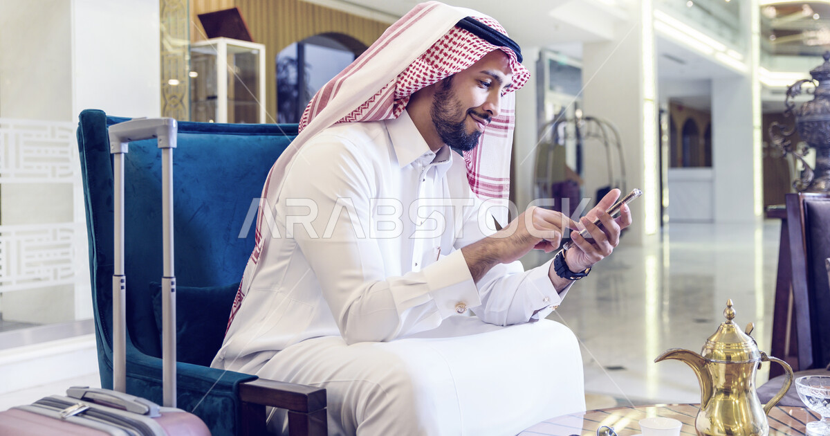A Saudi Arabian Gulf tourist sitting in the waiting room in the hotel ...