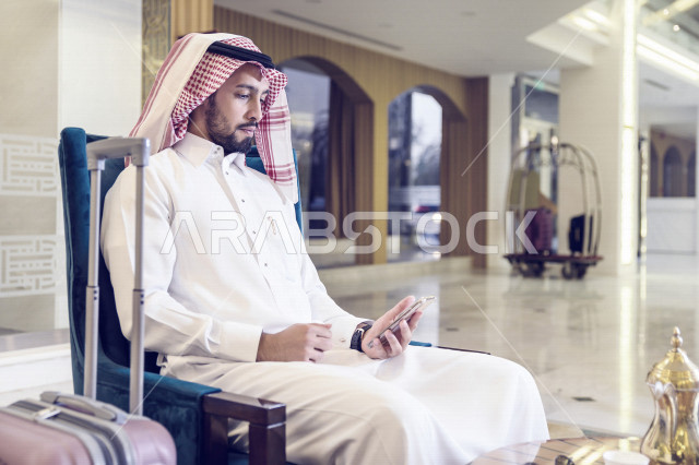 A Saudi Arabian Gulf tourist sitting in the waiting room in the hotel ...