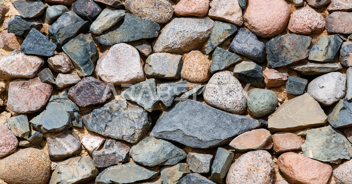 Close-up depiction of a group of colored gravel deposits, petrified ...