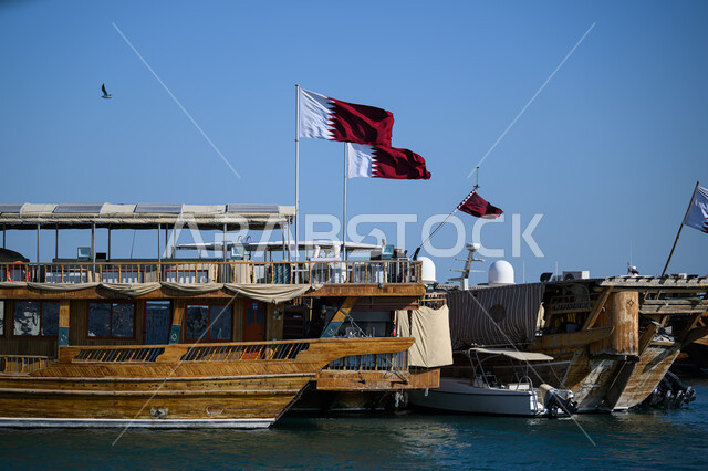 Famous coastal landmarks and tourist places, Qatar flags fluttering in ...