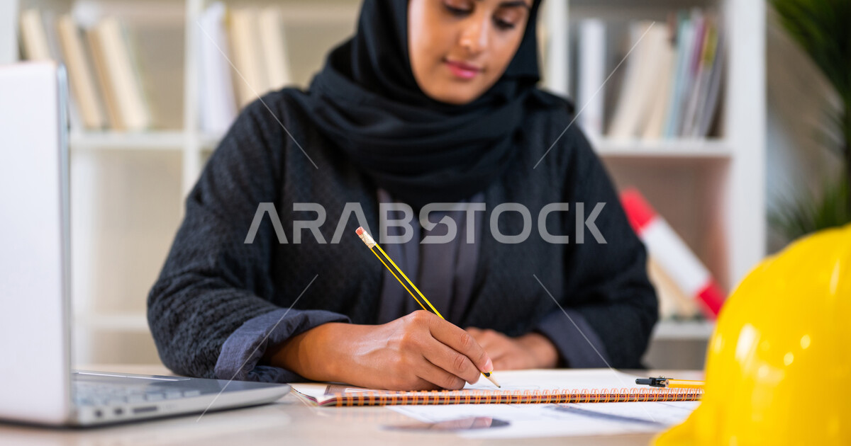 A Saudi Arabian Gulf university student studying architecture, studying ...