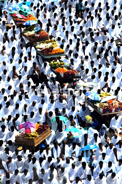 Pilgrims carrying different types of food and fruits, performing Hajj ...