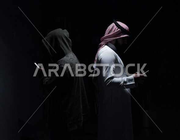 A Saudi Arabian Gulf man using his mobile phone, exposure to hacking ...