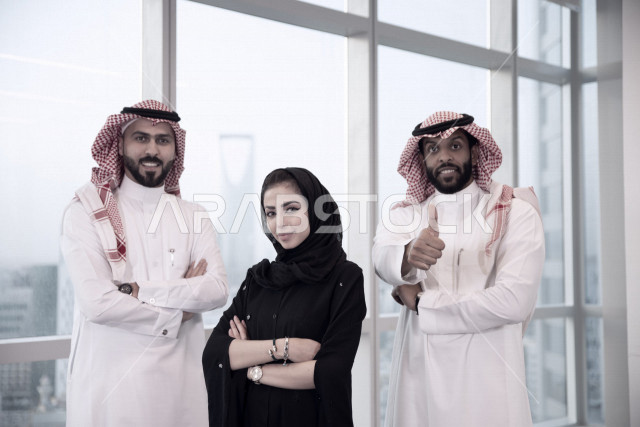 Gulf Arab Saudi businessmen and businesswoman, successful and happy ...