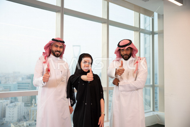 Gulf Arab Saudi businessmen and businesswoman, successful and happy ...